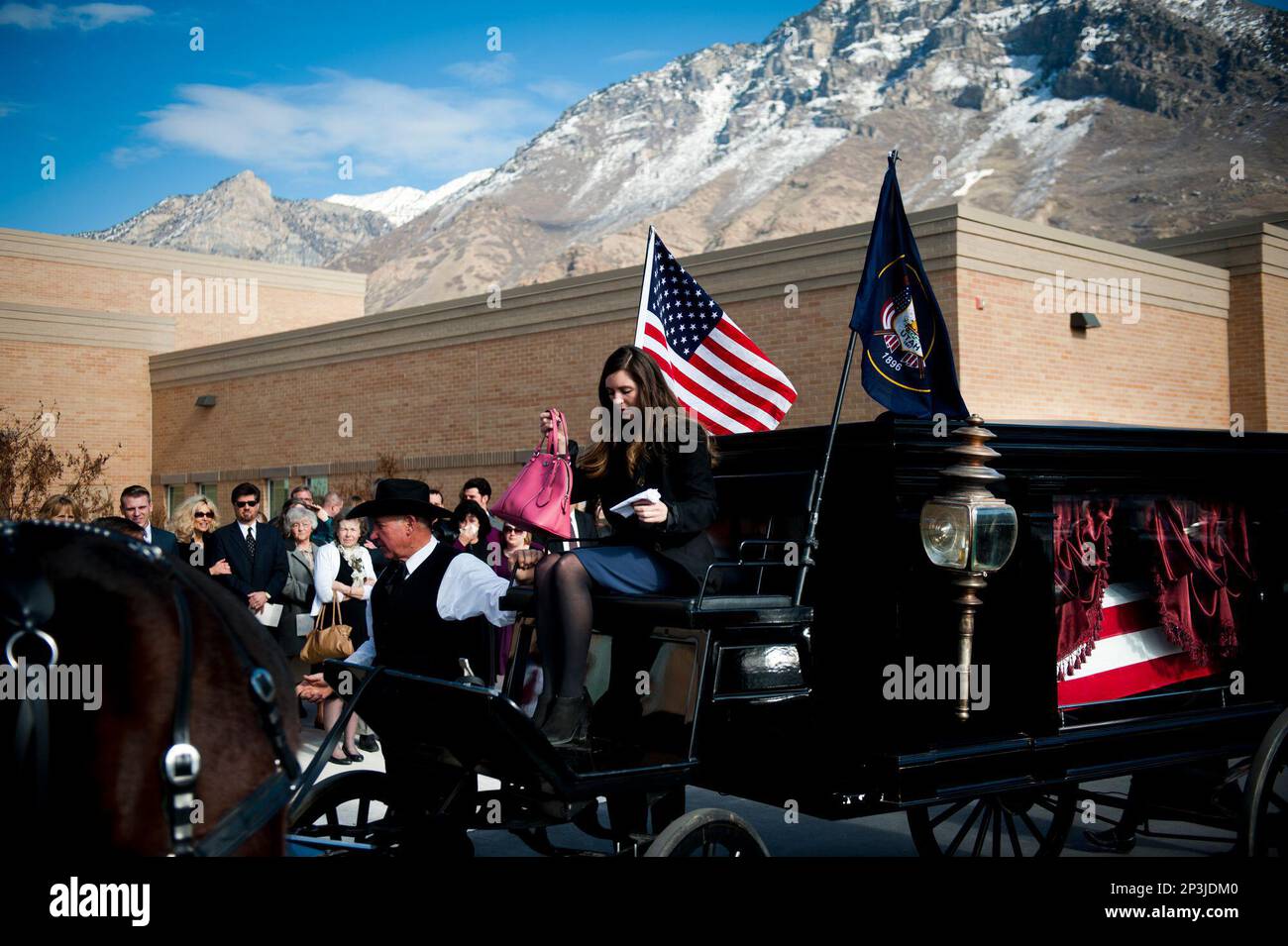 Becky Lockhart's daughter Hannah Lockhart climbs onto a horse-drawn ...