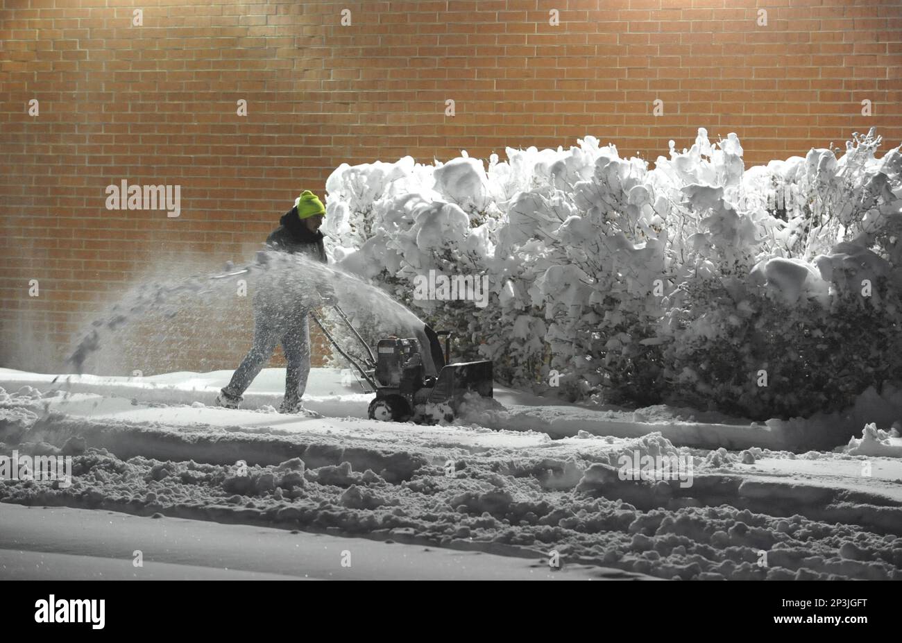 Daniel Bramlet cleared snow at a local business before dawn Thursday ...
