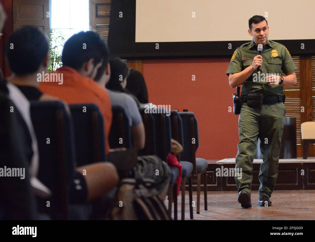 Border Patrol Agent Joe Gutierrez speaks to participants during a ...