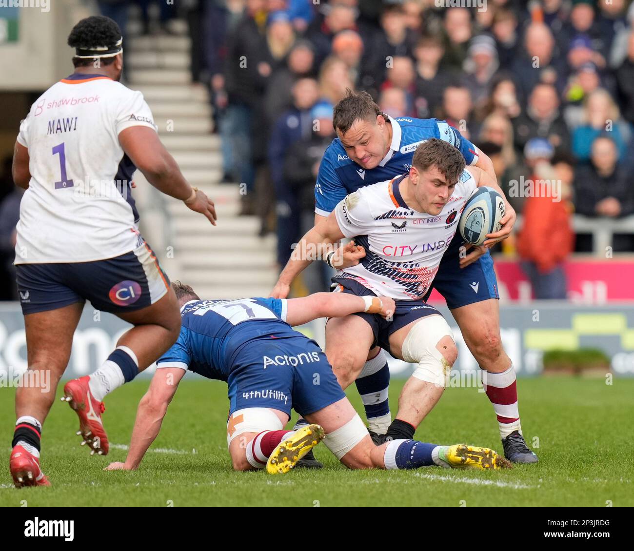 Coenie Oosthuizen #3 of Sale Sharks tackles Theo Dan #2 of Saracens during the Gallagher ...