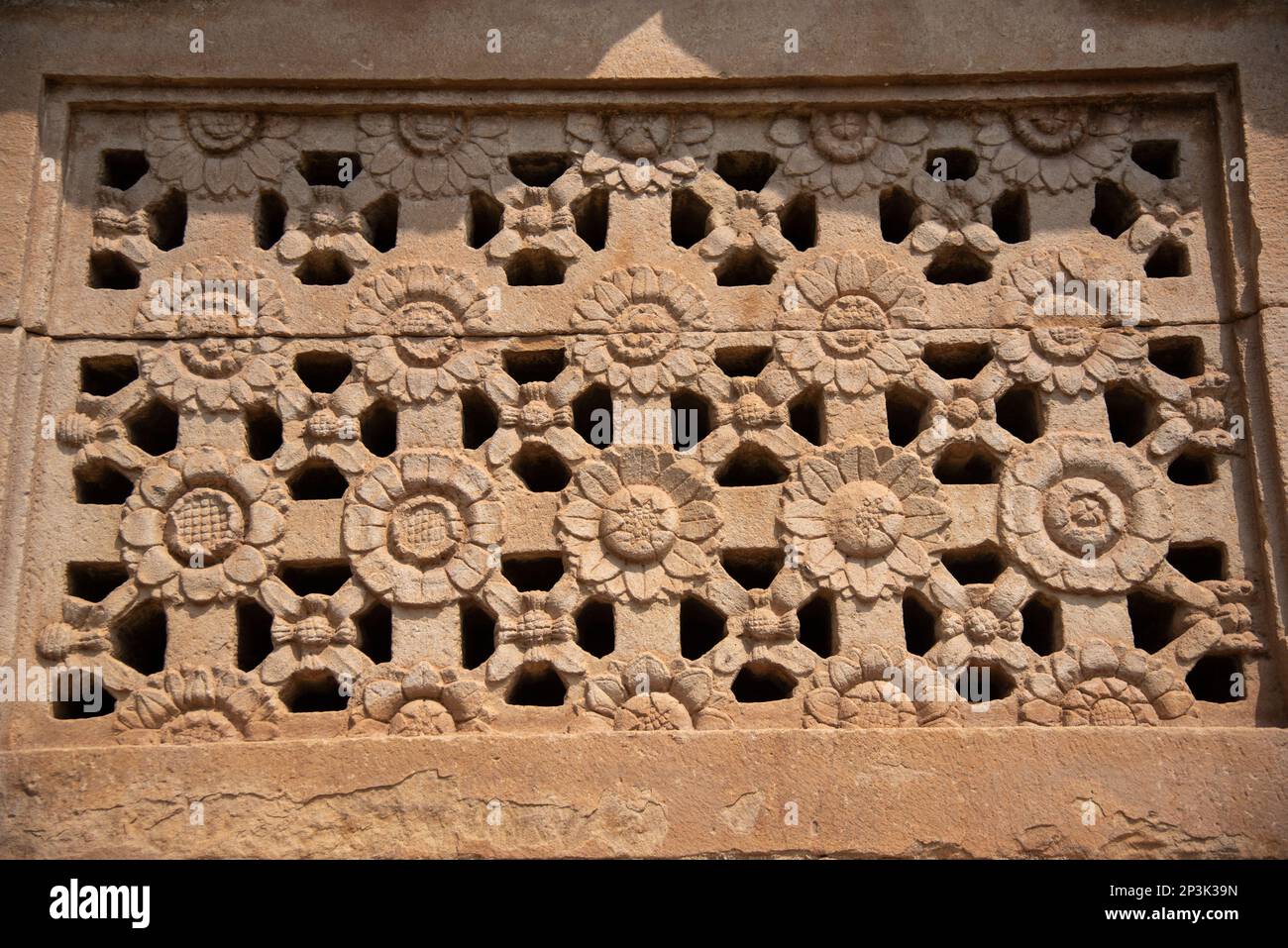 Ornately sculpted windows of temples in Aihole in Karnataka, India ...