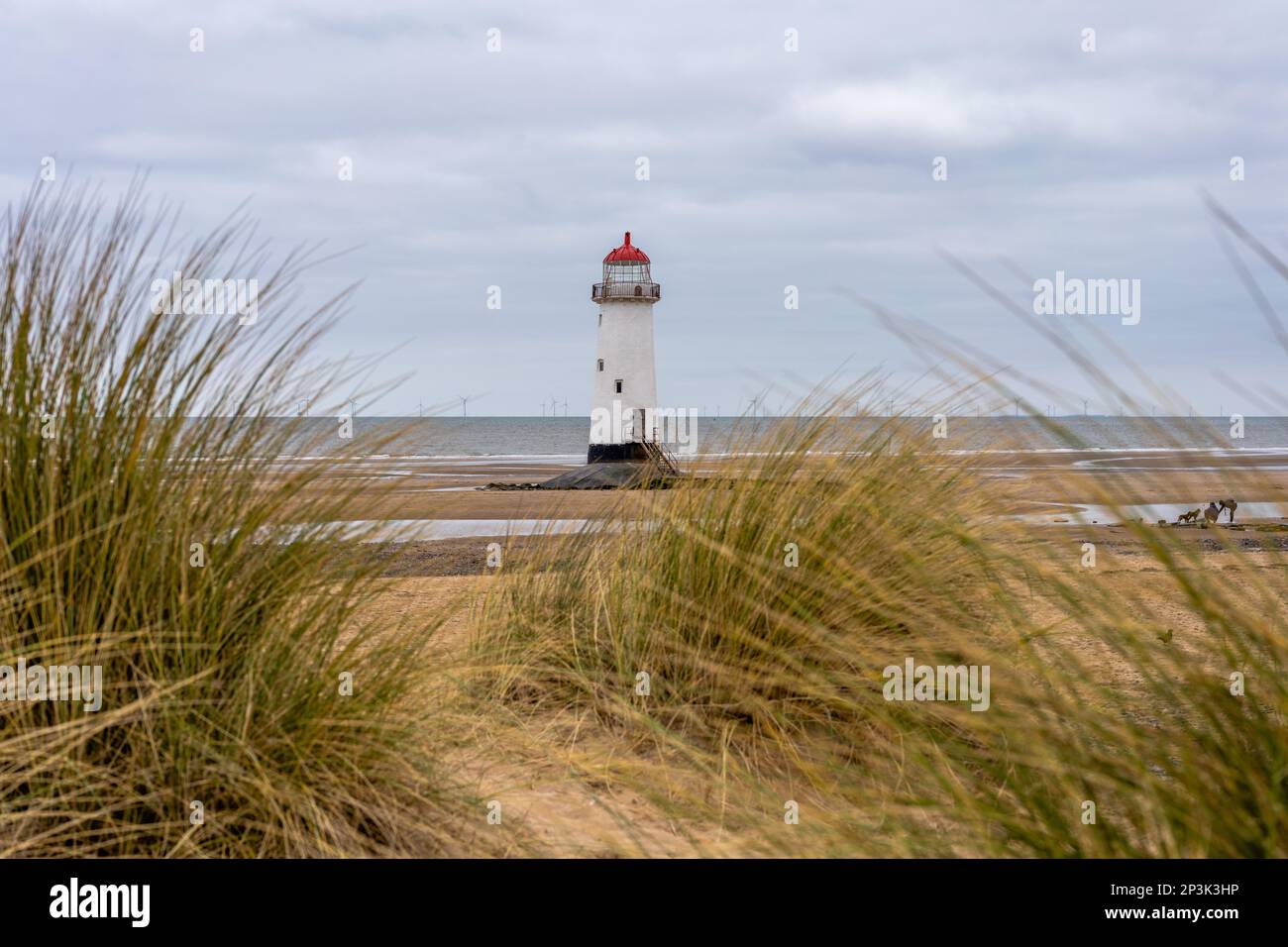 Talacre beach Point of Ayr light house peaking out above sand dunes and ...