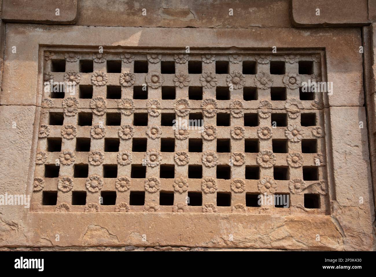 Ornately sculpted windows of temples in Aihole in Karnataka, India ...