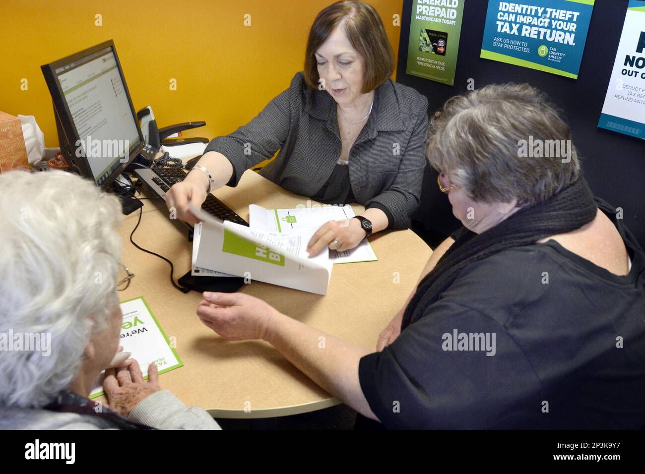 Marsha Anderson, a Senior Tax Advisor 5 with H&R Block, works on taxes ...