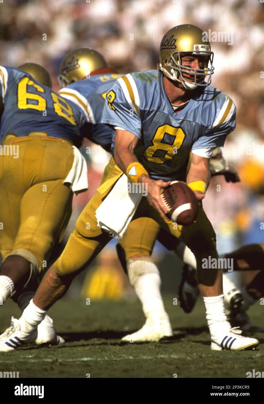 UCLA quarterback Troy Aikman sets to lateral during play in 1988. (AP ...