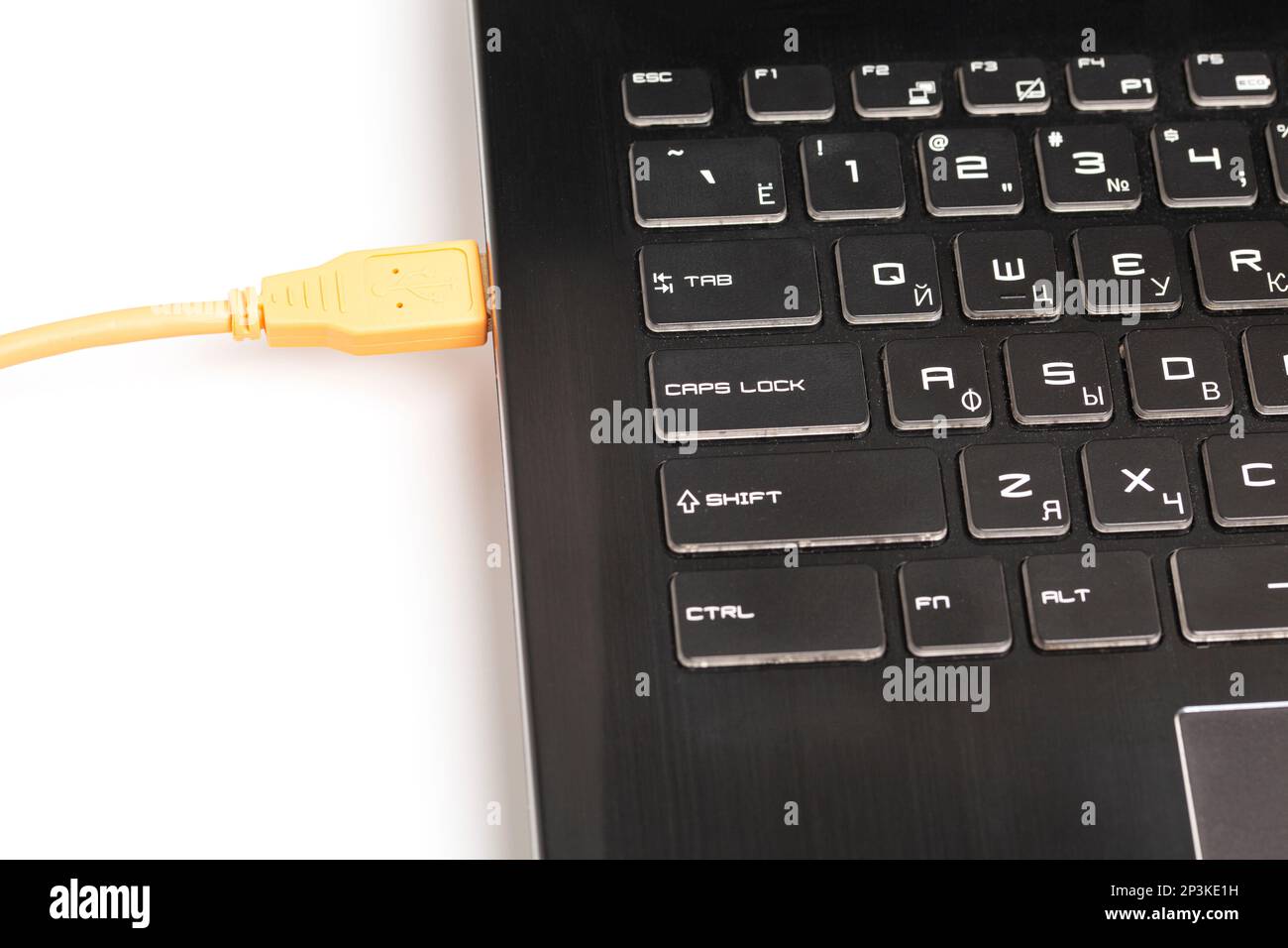 laptop with USB orange cable Stock Photo - Alamy