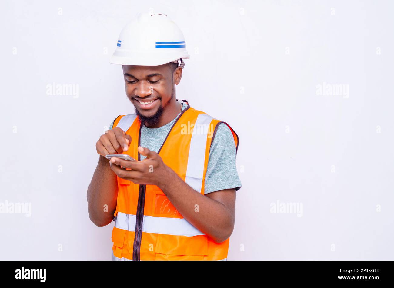 excited smart engineer excited as he uses his cell isolated over white ...
