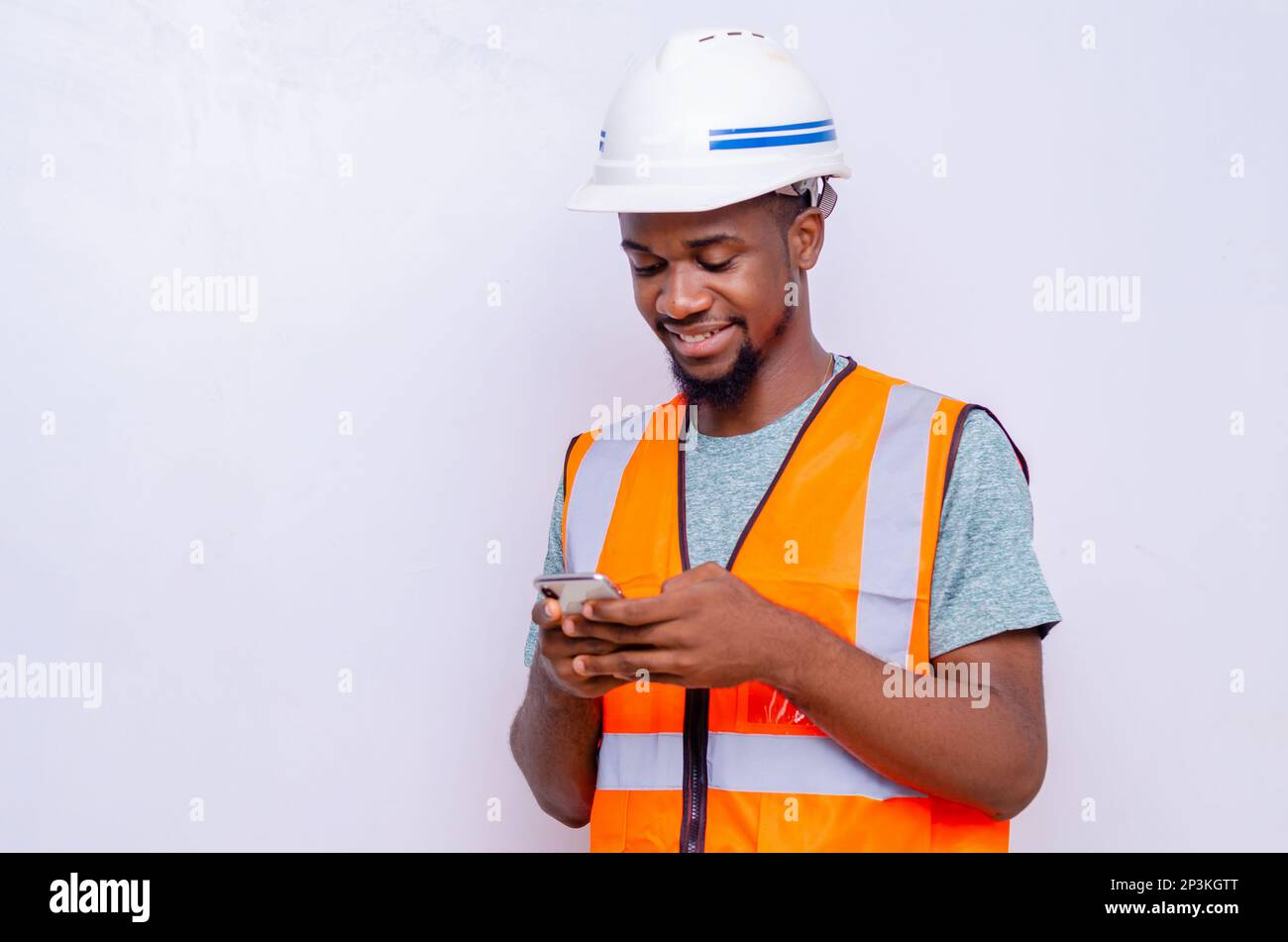 smart engineer excited as he uses his cell Stock Photo - Alamy