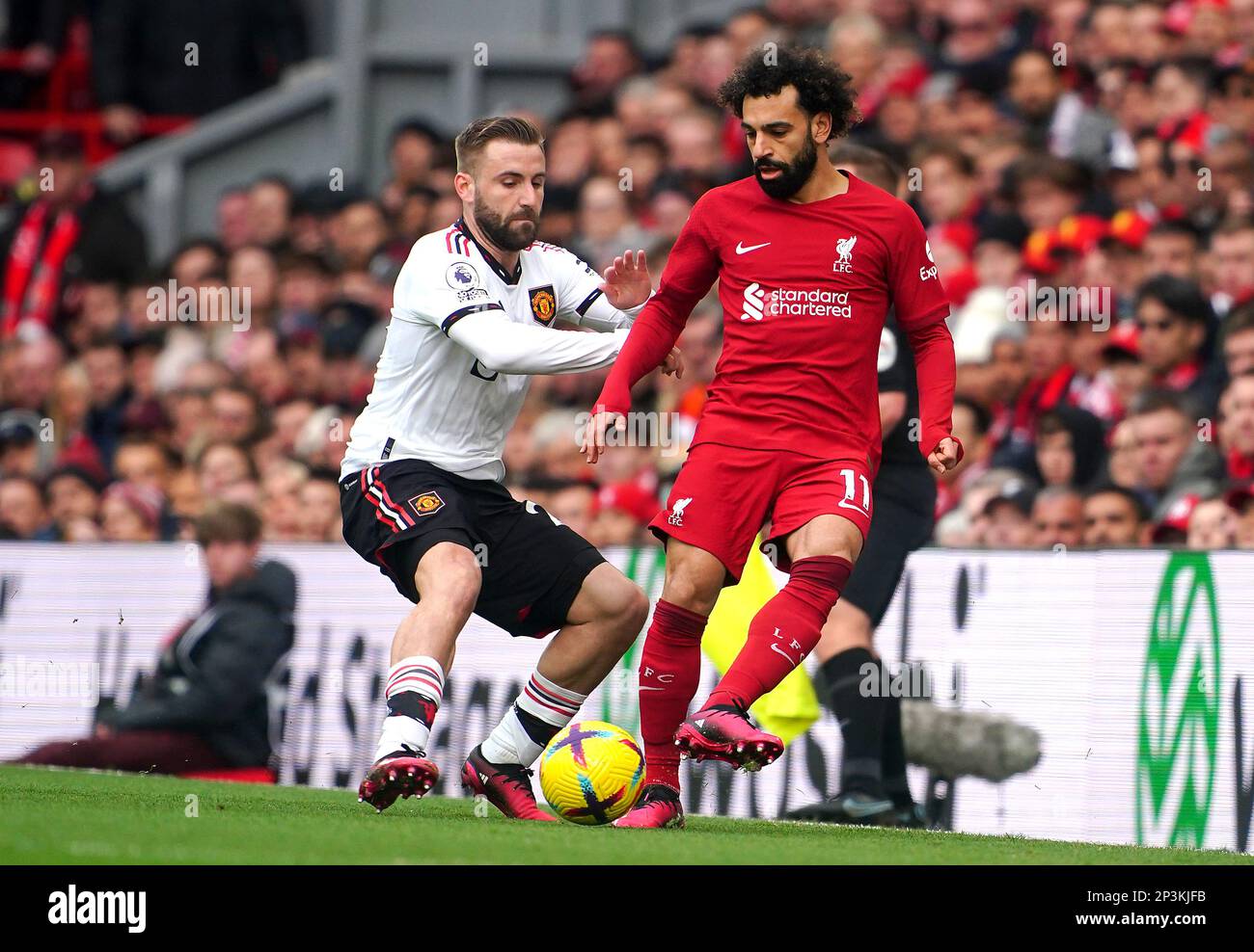 Manchester United's Luke Shaw (left) and Liverpool's Mohamed Salah ...