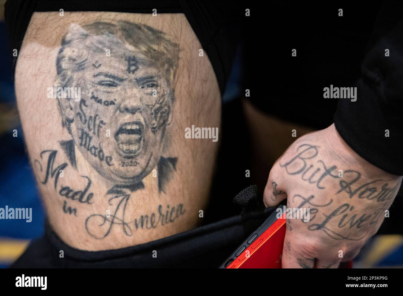 Rapper Forgiato Blow exposes his leg to show off a tattoo depicting ...
