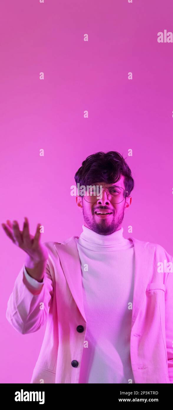 Stunned face wtf expression pink neon man shrug Stock Photo - Alamy