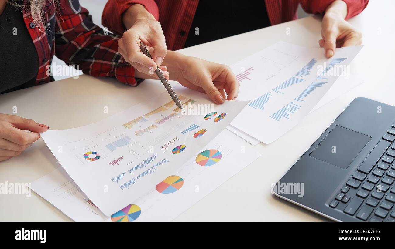 Statistics review business meeting female team Stock Photo - Alamy