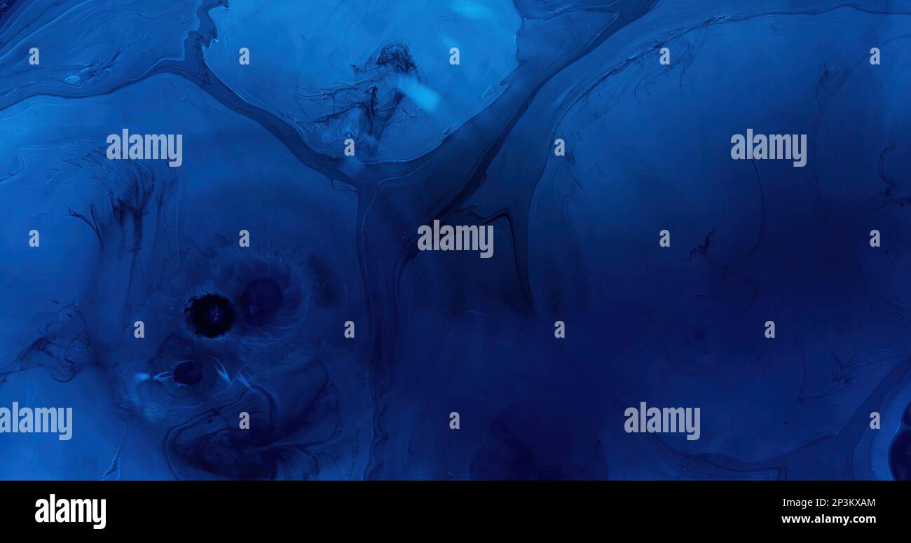 Paint water ink drop ripple texture fluid art blue Stock Photo - Alamy