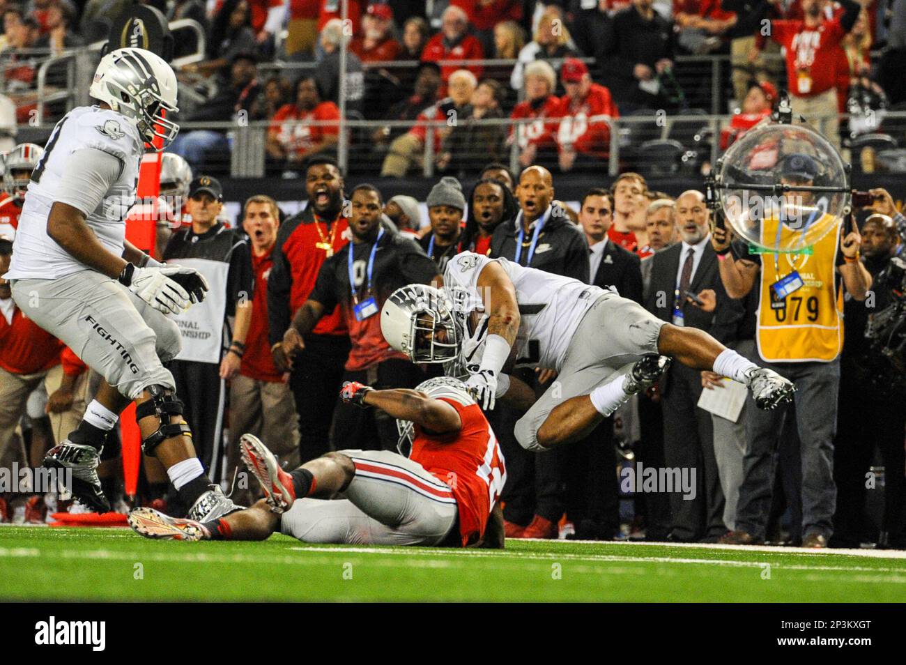 Oregon running back Thomas Tyner (24) is upended by Ohio State ...