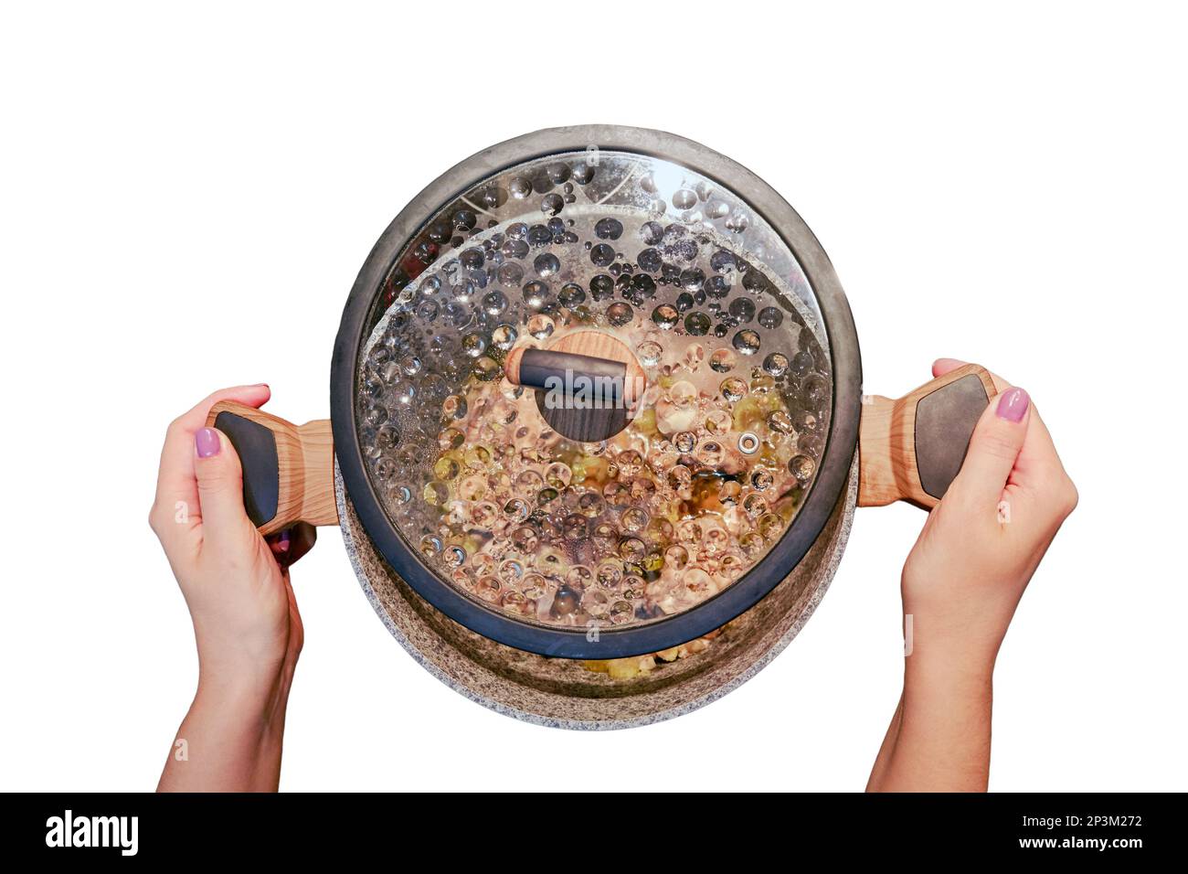 Female hands remove the pan standing on the electric kitchen stove ...