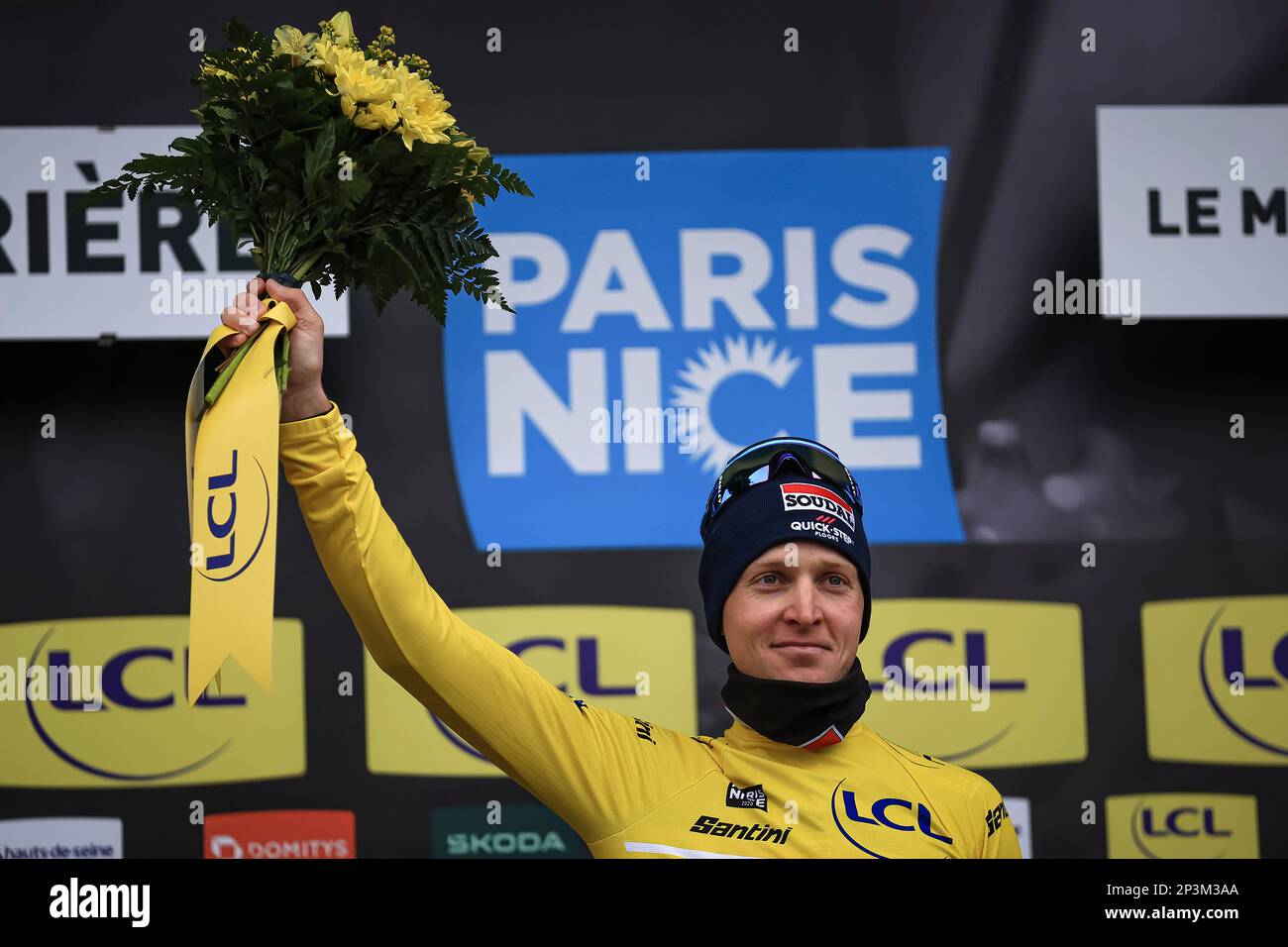 Soudal Quick-Step's Belgian rider Tim Merlier reacts on the podium ...