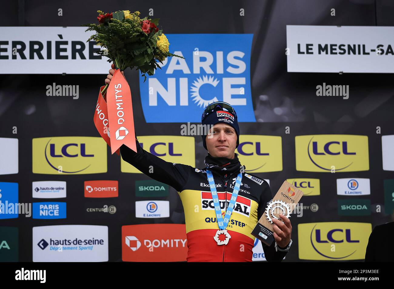 Soudal Quick-Step's Belgian rider Tim Merlier reacts on the podium ...
