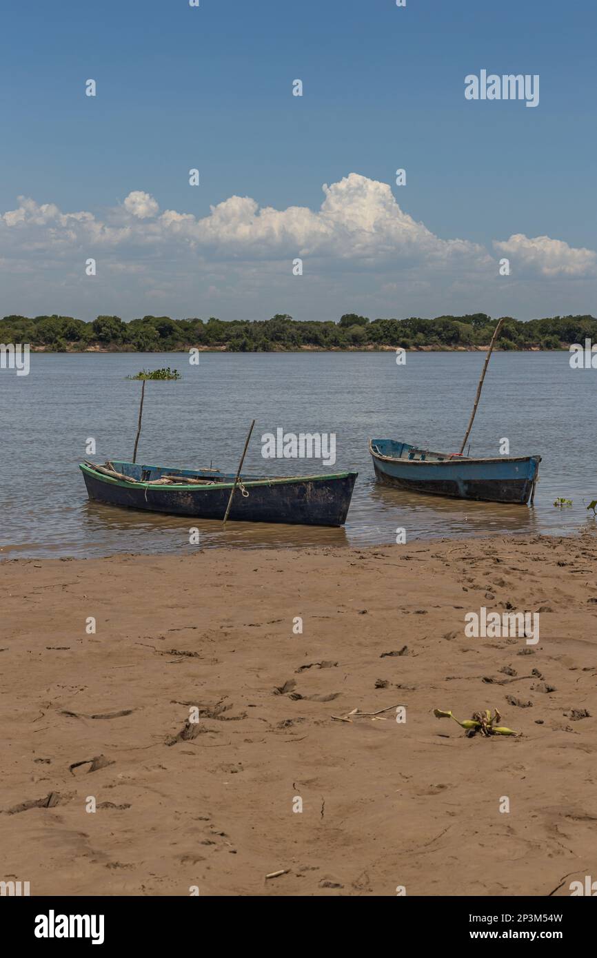 Two canoes moored on the river bank Stock Photo - Alamy