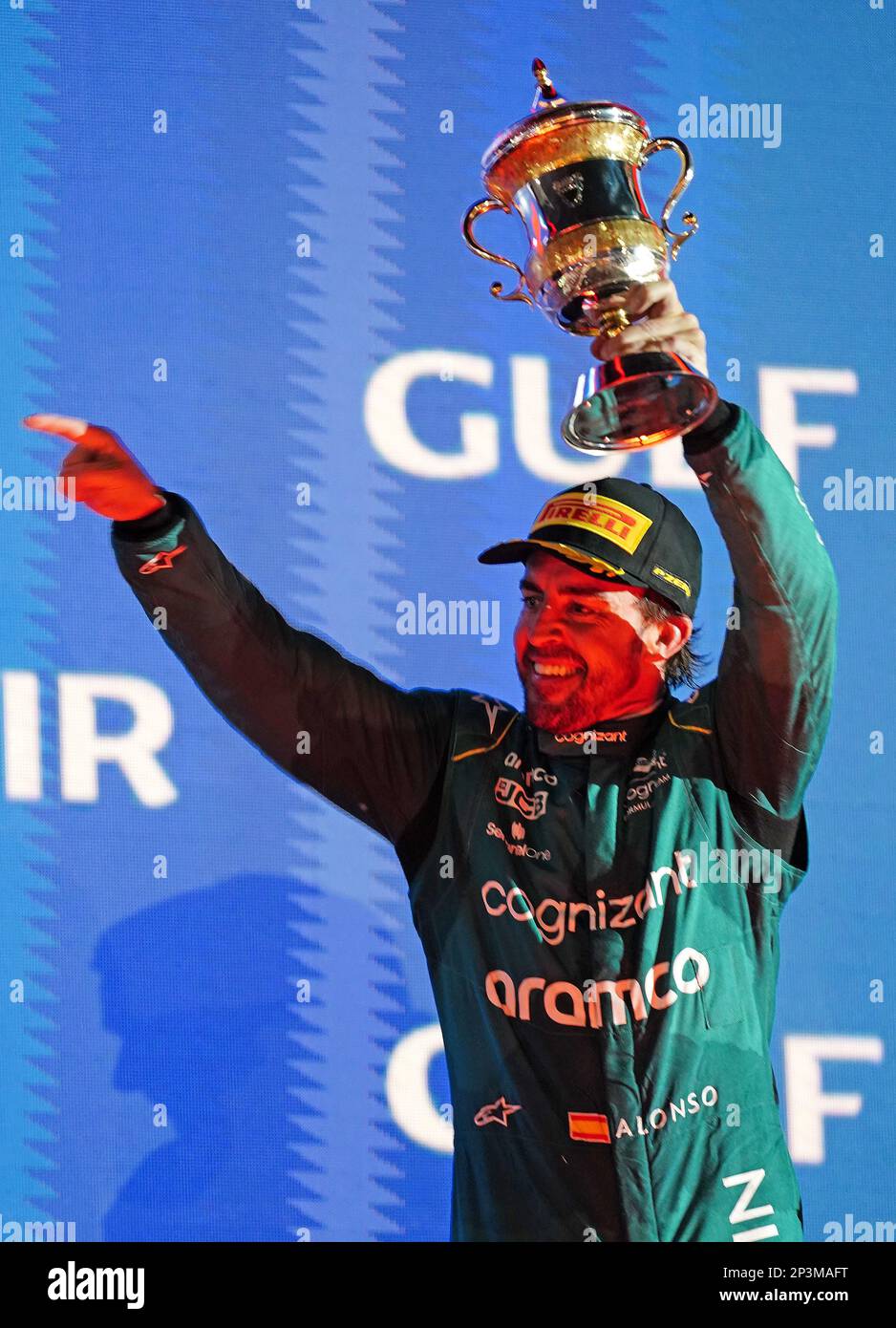 Third place Aston Martin's Fernando Alonso celebrates on the podium ...
