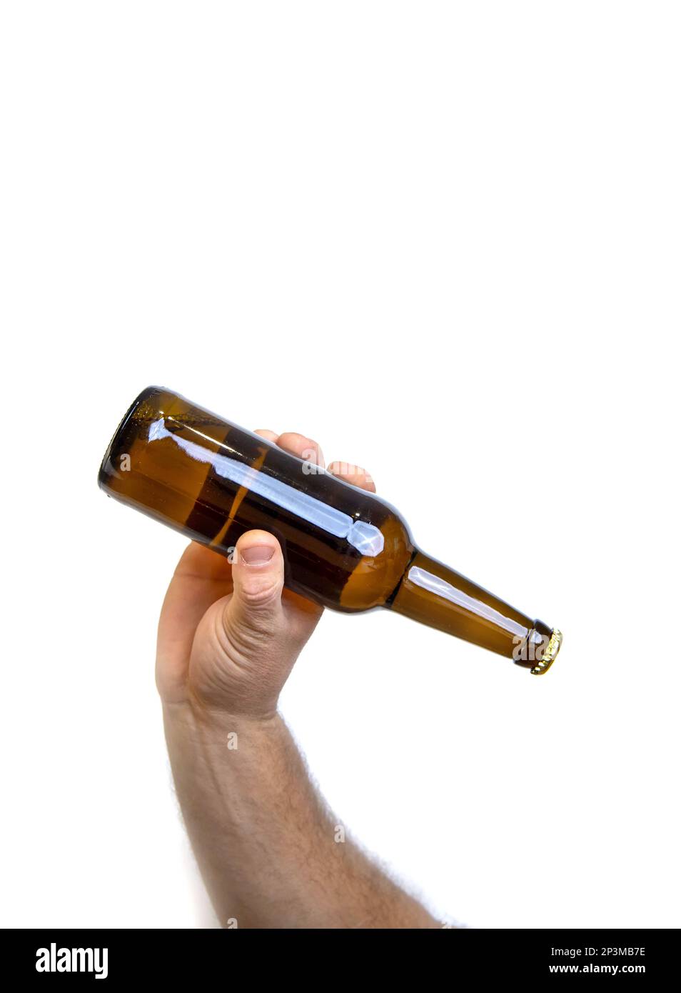 Beer bottle in hand isolated on white Stock Photo - Alamy