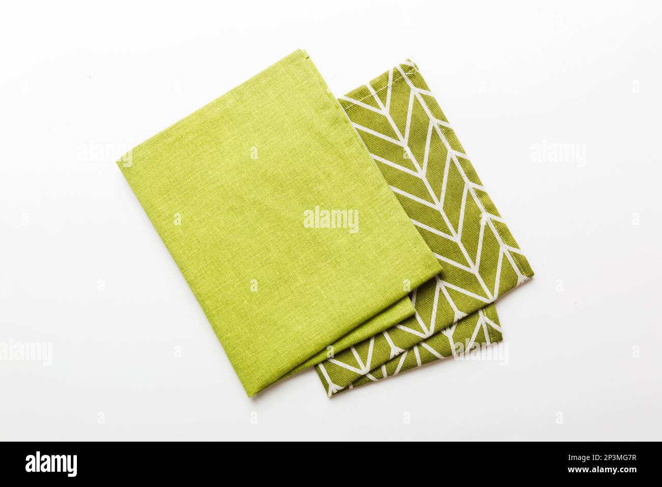 top view with green kitchen napkin isolated on table background. Folded ...