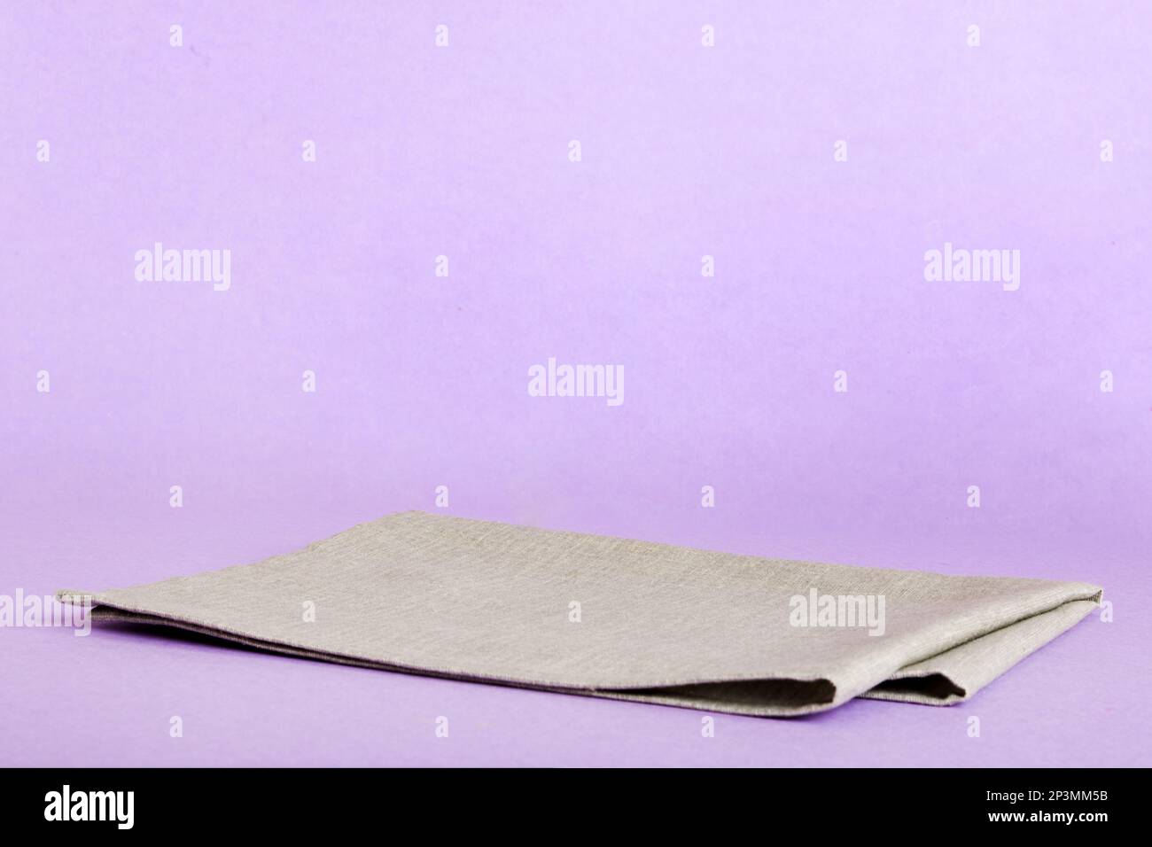 top view with gray kitchen napkin isolated on table background. Folded ...