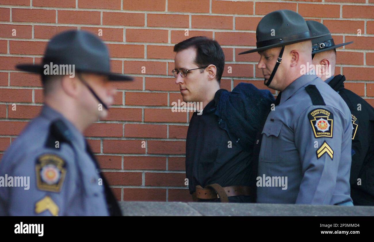 Eric Frein is led away by Pennsylvania State Police Troopers at the ...