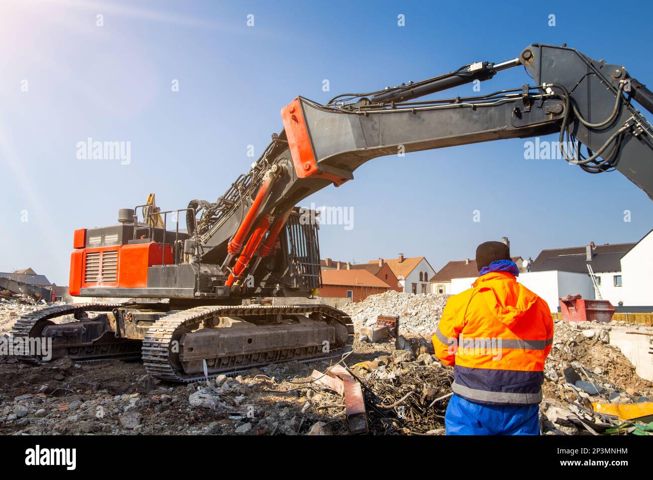 Demolition excavator in action Stock Photo - Alamy