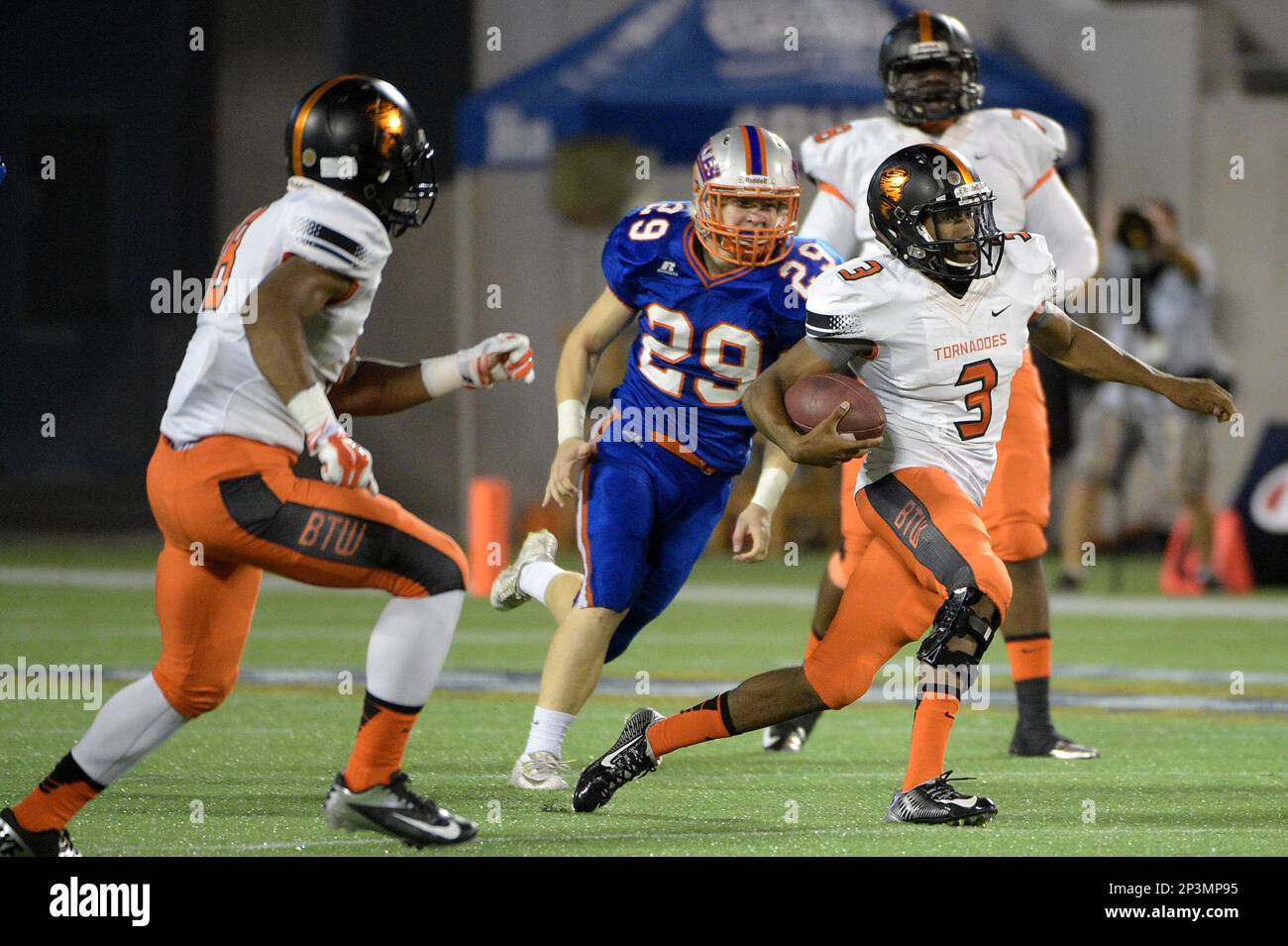 Booker T. Washington quarterback Maurice Alexander (3) scrambles for ...