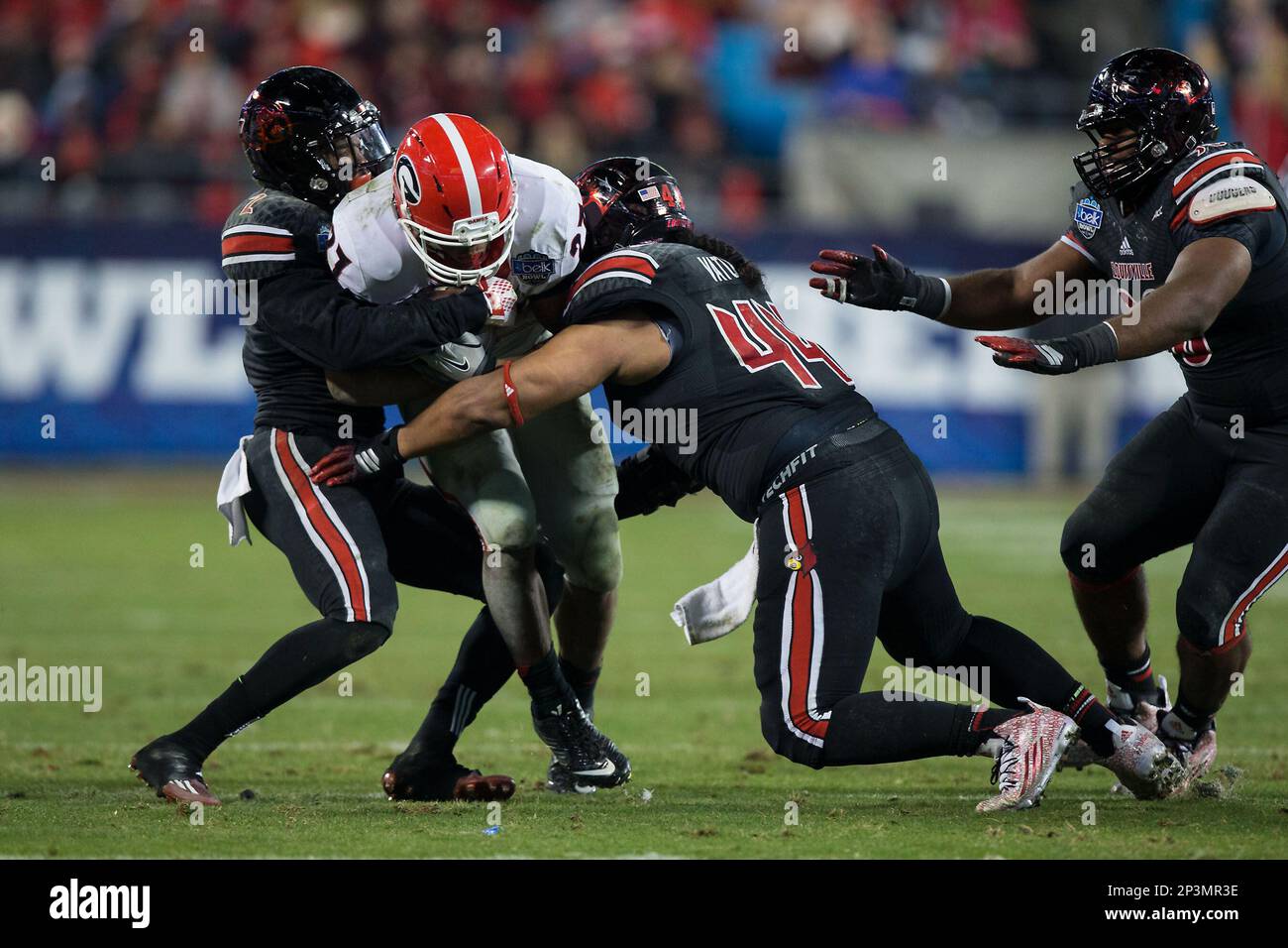 Nick Chubb (27) of the Georgia Bulldogs is wrapped up by James Sample ...