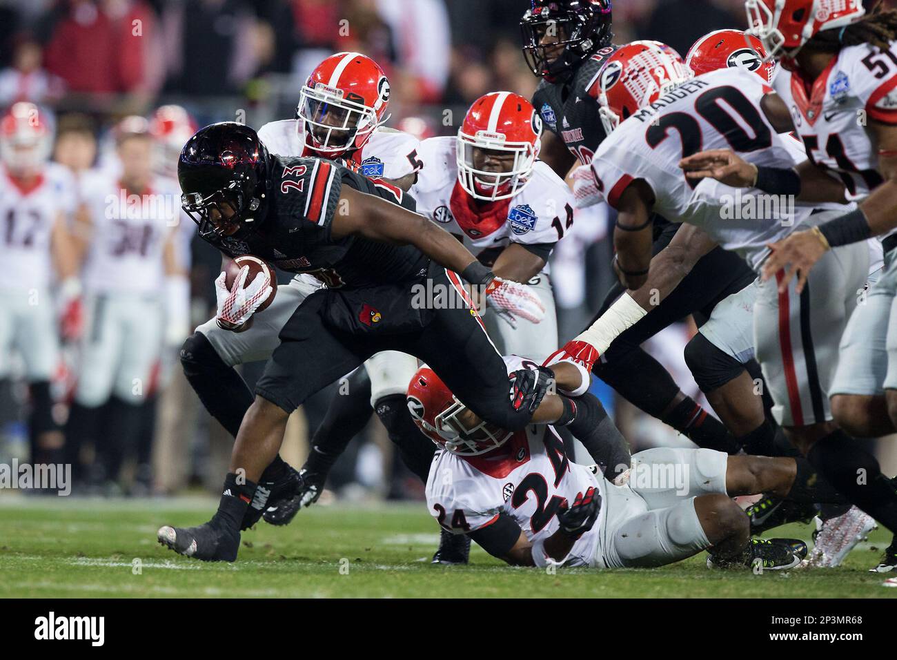 Brandon Radcliff (23) of the Louisville Cardinals runs with the ...