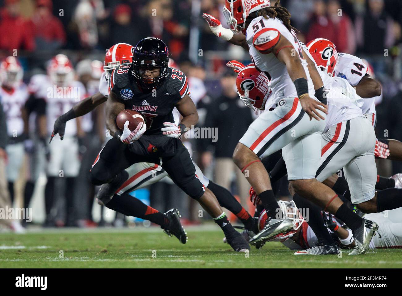 Brandon Radcliff (23) of the Louisville Cardinals runs with the ...