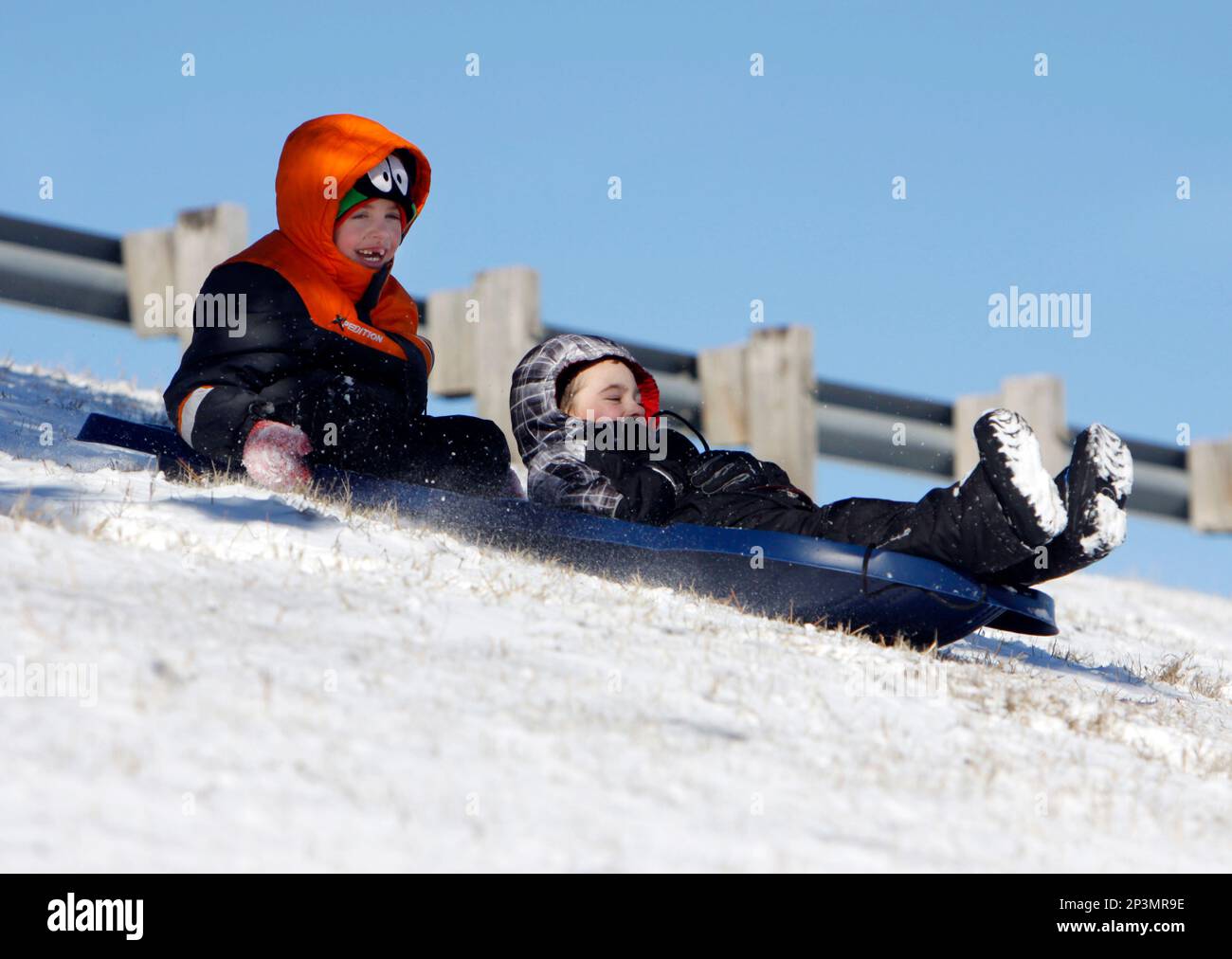 Magnus LeGron (left) and Quintin MacArthur, both 7, sled down the ...