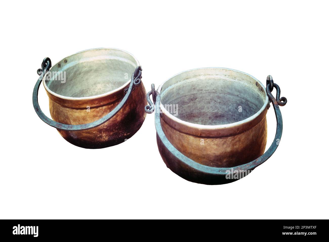 Large cast iron boilers for cooking in ancient times, isolated on a ...