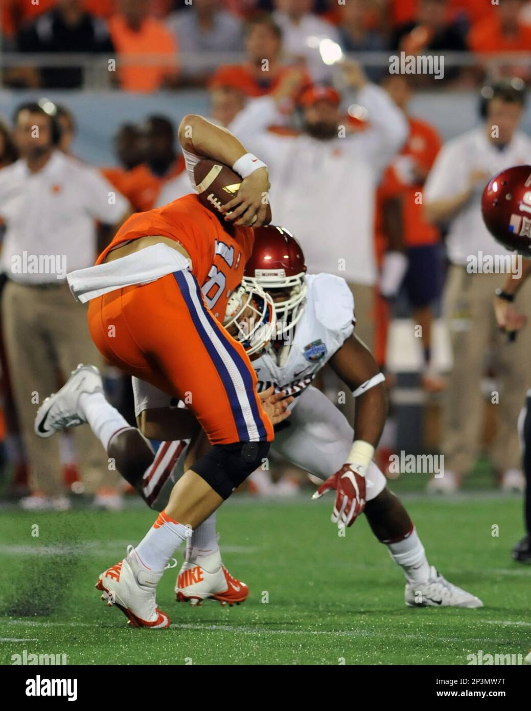 Quarterback Cole Stoudt (18) of the Clemson Tigers loses his helmet ...