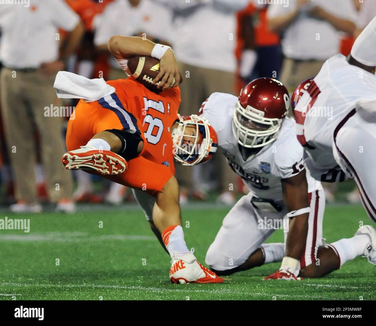 Quarterback Cole Stoudt (18) of the Clemson Tigers tumbles after a ...