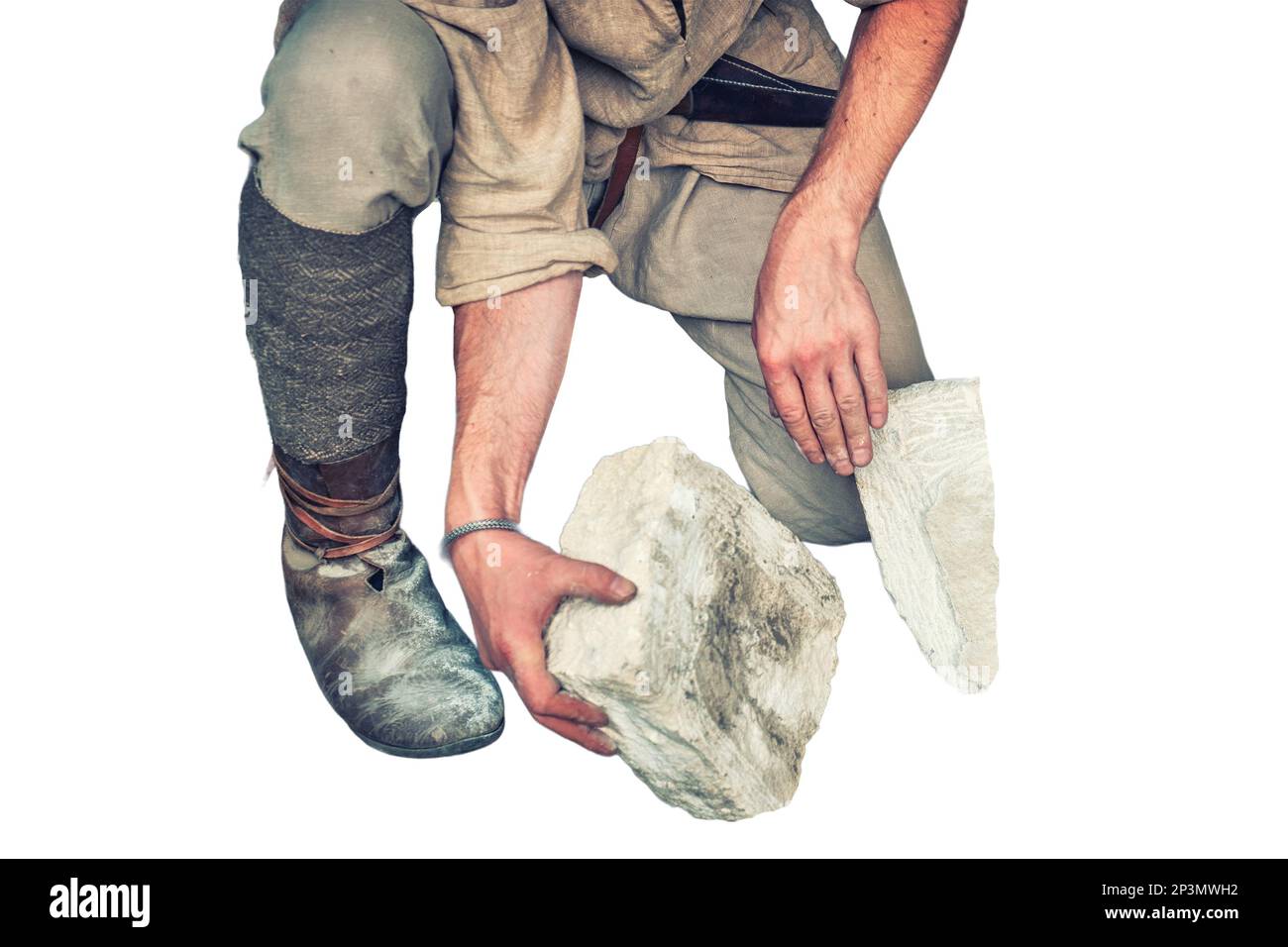 Working in a quarry holding stones, isolated on a white background. The ...