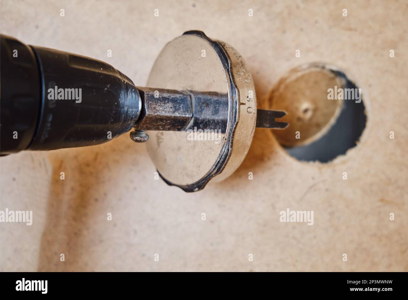 Drilling round holes with a crown on the drill bit. Sawing furniture ...