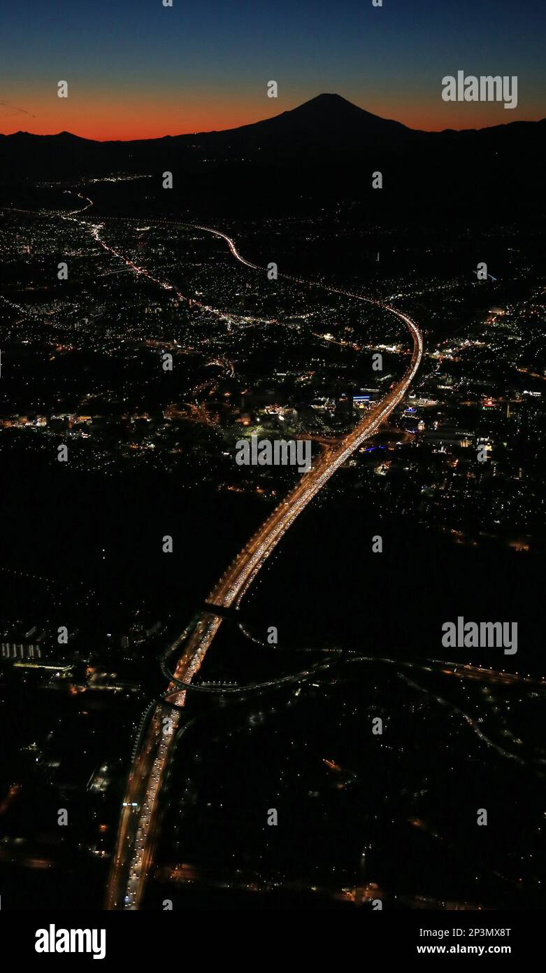 An aerial picture shows a light rail at the Ebina toll gate of the ...