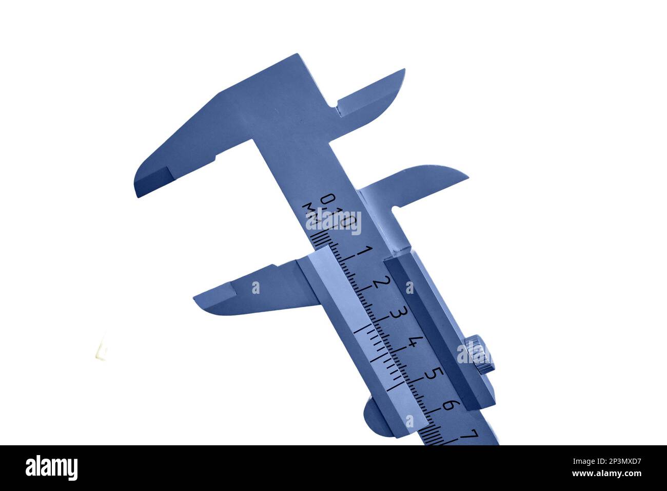 A large open caliper on a background of yellow wall, isolated on a ...