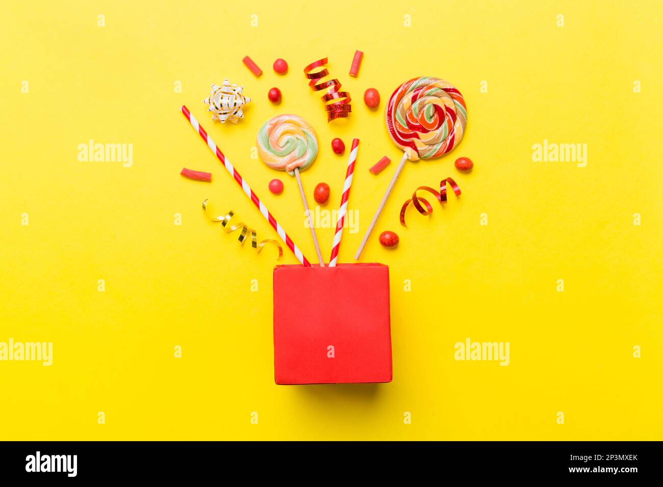 gift box in corner full of assorted traditional candies falling out on ...