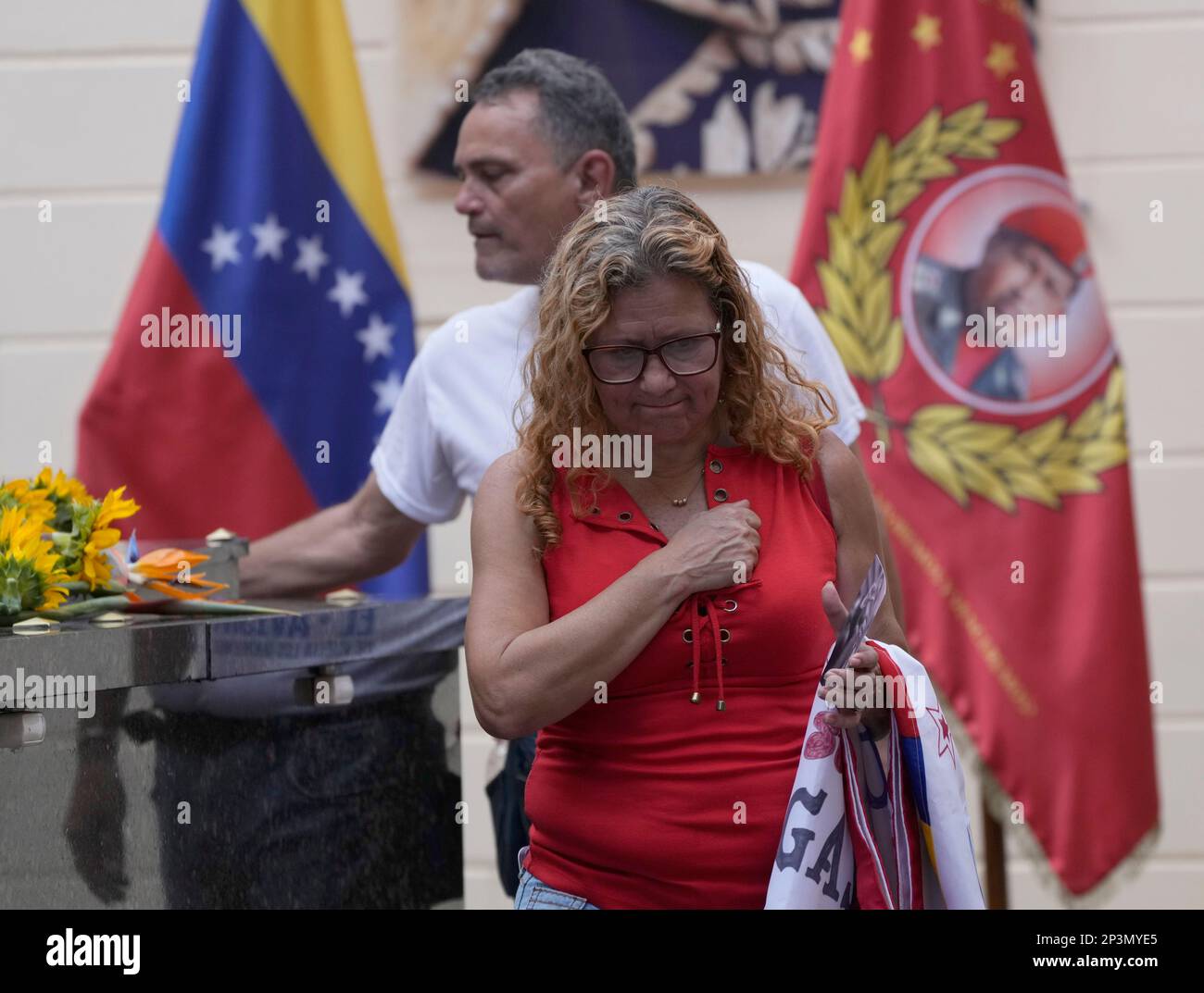 Visitors pay their respects on the tomb of late Venezuelan President ...