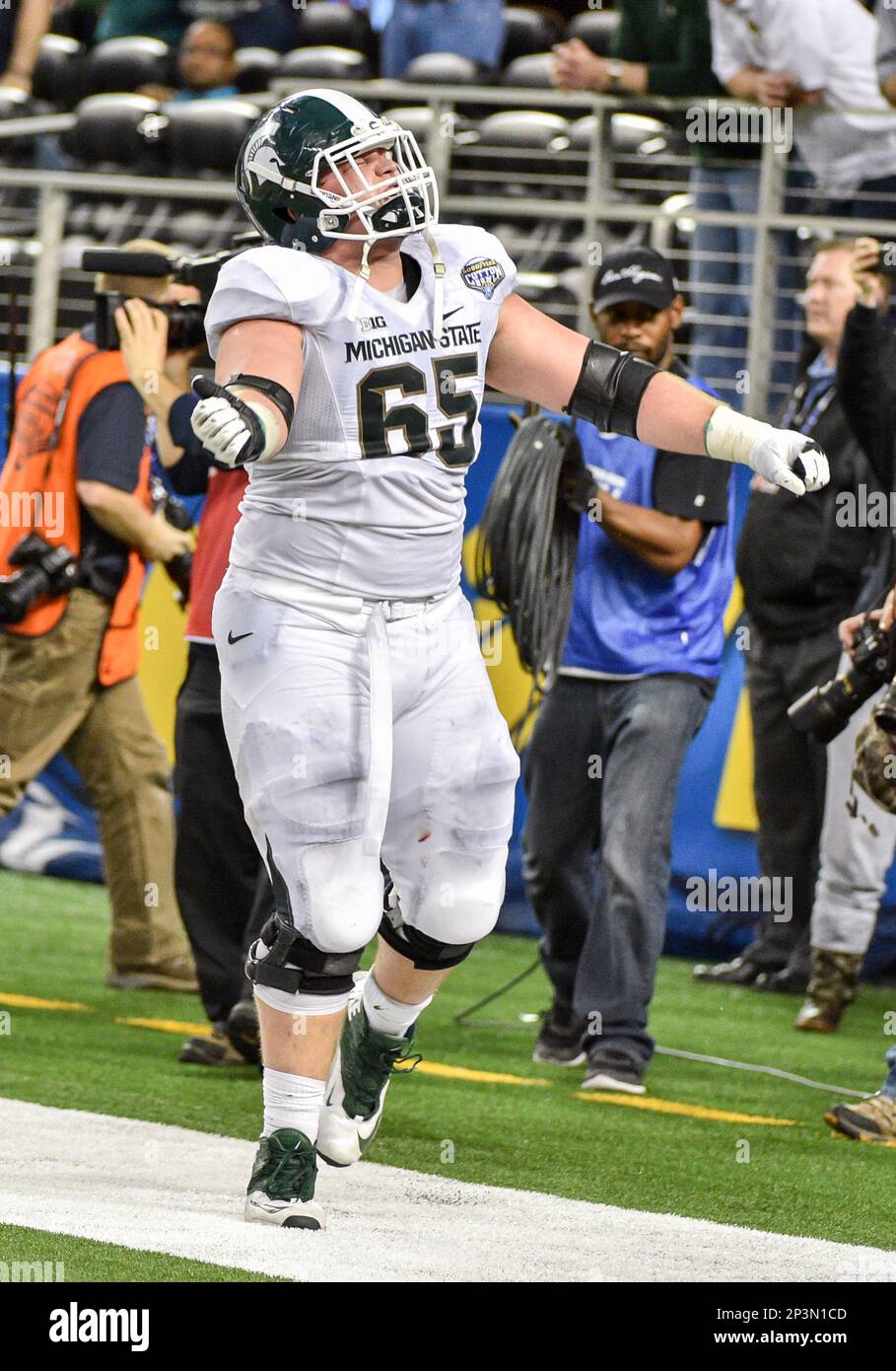 Michigan State Spartans center Brian Allen (65) celebrates as they ...