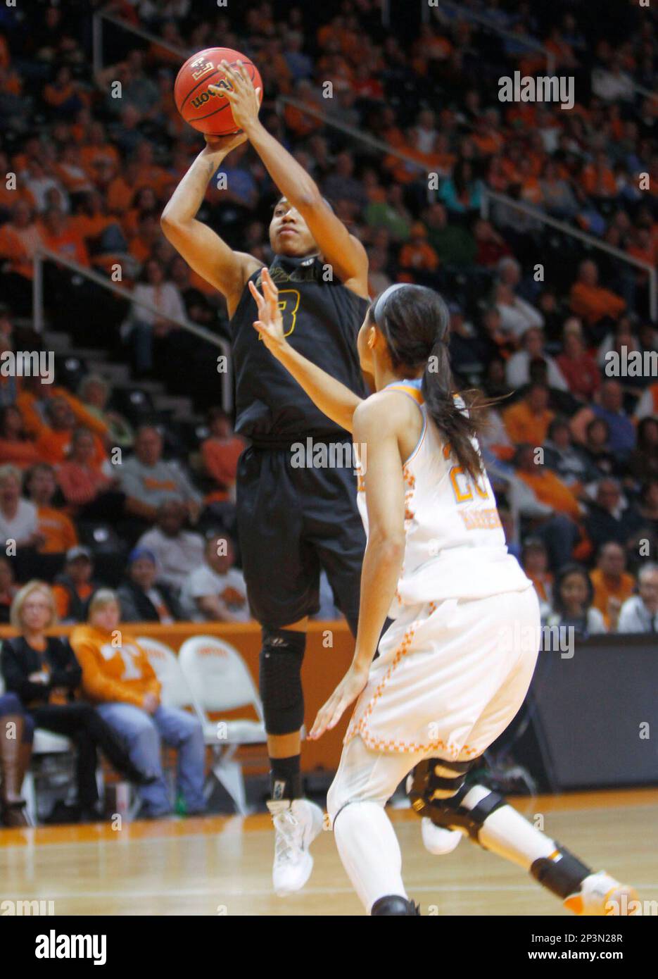 Missouri's Bree Fowler (3) goes for a basket over Tennessee's Isabelle ...