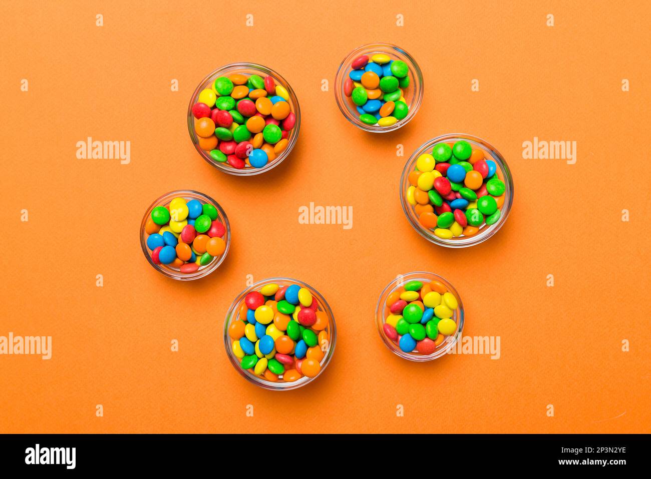 Different Colored Round Candy In Bowl And Jars Top View Of Large Variety Sweets And Candies