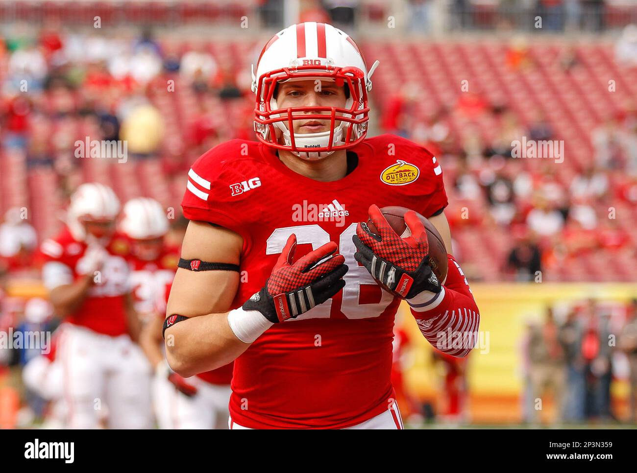 Wisconsin Badgers fullback Derek Straus (26) warms up prior to the game ...