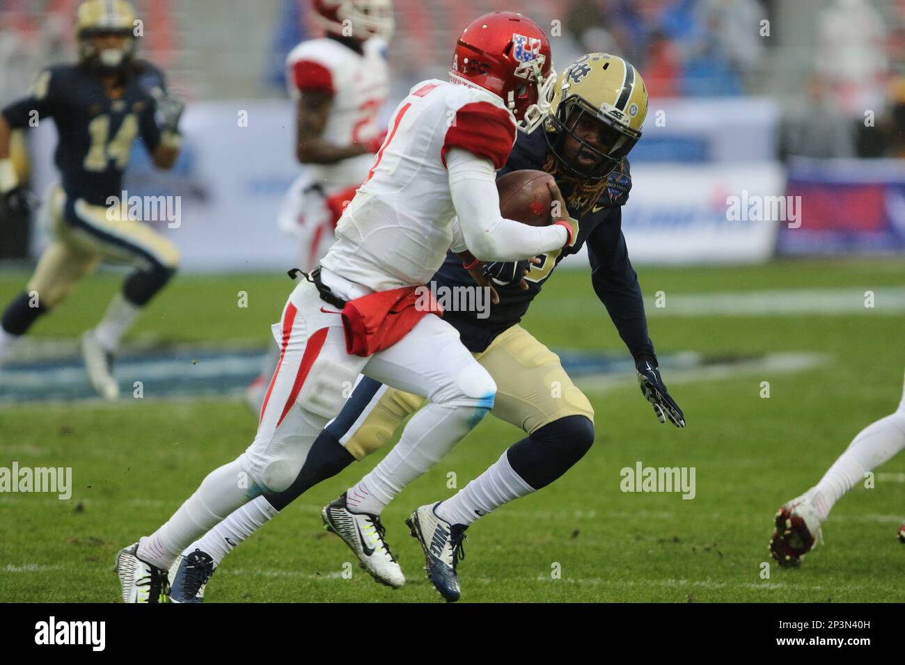 02 January 15: Houston Cougars quarterback Greg Ward Jr. (1) runs ...