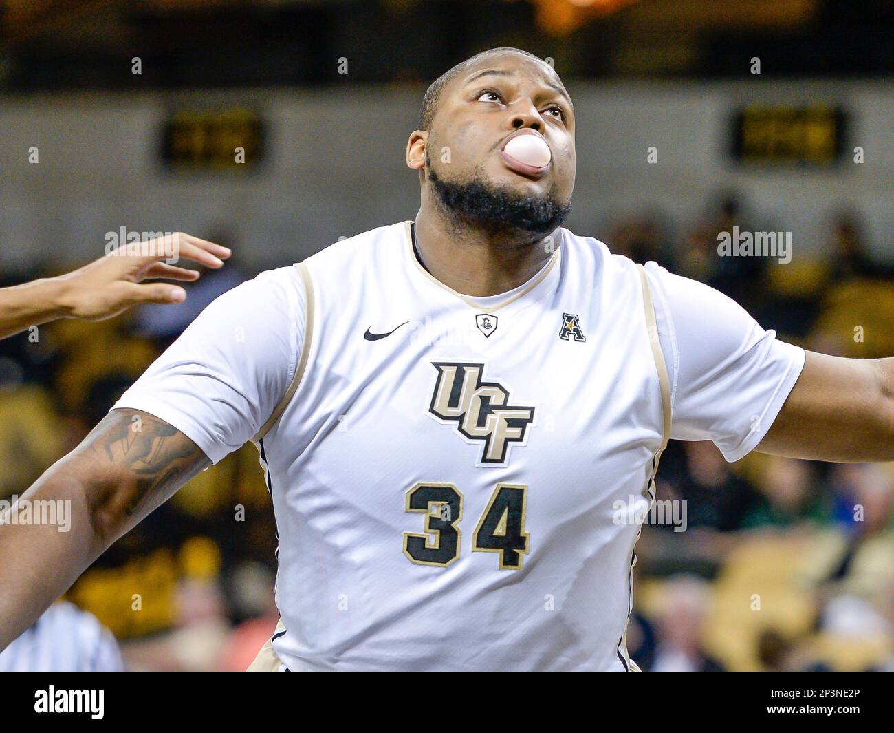 December 31, 2014 - Orlando, FL, U.S: UCF Knights center Justin McBride (34) blows a bubble at ...