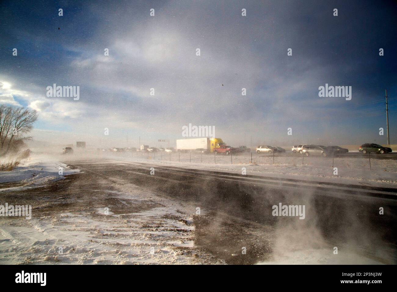 Strong winds blow snow across Frontage Road in Farmington, Utah ...