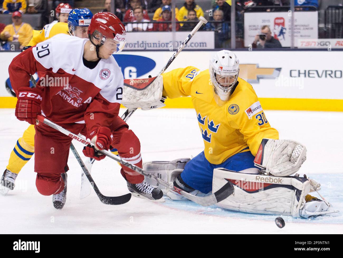 Sweden goalie Linus Soderstrom (30) makes a pad save against Denmark ...